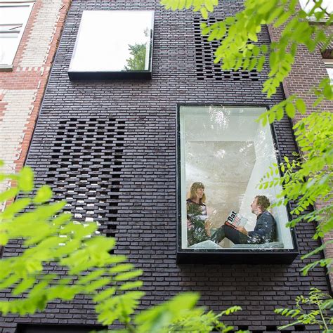 Villa Sg21 Is A Monolithic Blackened Wood House Topped With A Turfed Roof
