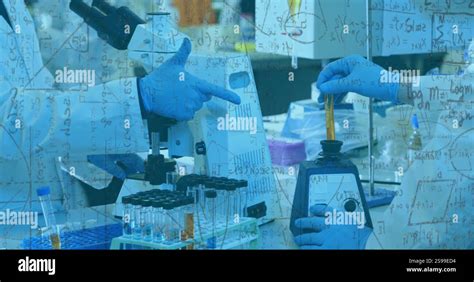 Mathematical Equations Image Over Scientists Working With Lab Equipment
