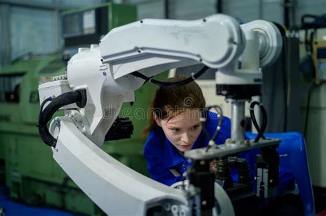 Female Robotics Engineer Working With Programming And Manipulating