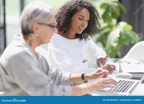 Software Development Team Discussing Algorithms On Computer Screen In