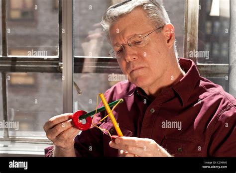Mature Man Solving Logic Puzzle Stock Photo Alamy