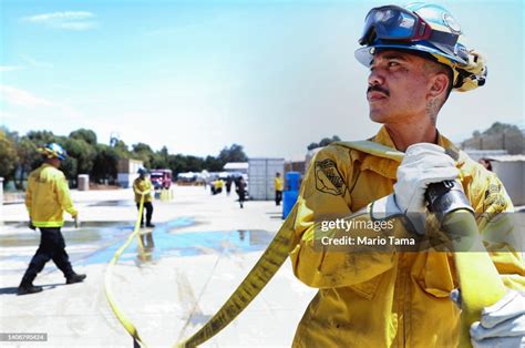 Cadets Who Were Formerly Incarcerated Load A Fire Hose Onto A Fire