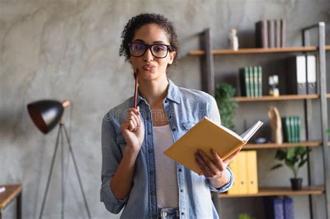Photo Of Attractive Corporate Agent Girl Hold Book Contemplate Loft