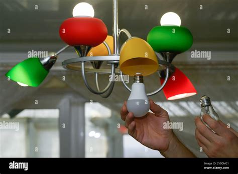 The Concept Of Replacing An Incandescent Lamp With An LED One Stock Photo Alamy