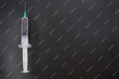 Premium Photo Coffee Beans And Injection Syringe Caffeine Addiction Concept