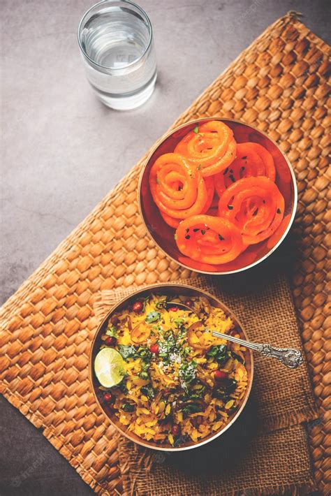 Premium Photo Aloo Poha With Jalebi Snack Combination Also Called Imarti And Kande Pohe