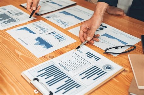 Premium Photo Analyst Team In Office Analyzing Financial Data Analysis Papers Entity