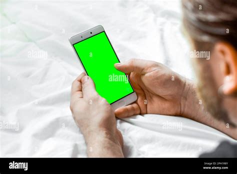 Young Bearded Man Using Green Chroma Key Screen Phone Relaxing In A