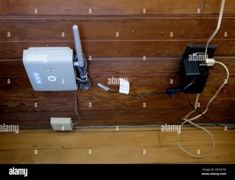 In This Friday May Photo A Wireless Device That Can Be Connected To A Home Phone For