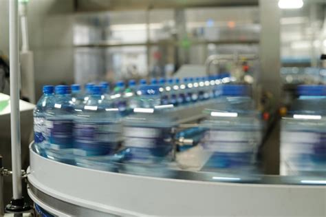 Premium Photo Moving Assembly Line With Capped Bottles