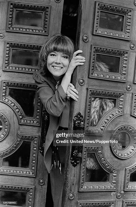 English Actress Diana Rigg Emerges From The Doors Of The Phoenix