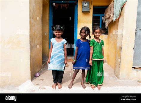Smiling Happy Indian Village Girls Standing In Front Of Their House