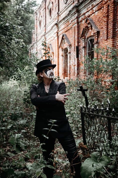 Bad Devil Or Evil Spirit Guy Looks At The Cross Devil Or Ghost Standing In The Dark Of