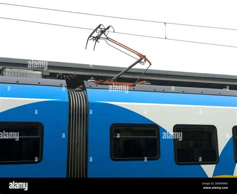 Close Up Of A Contemporary Blue And White Electric Train Featuring Its