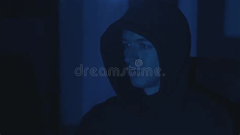 Portrait Of Dangerous Hacker Programmer Working On Computer Scheming Cyber Attack On Server In