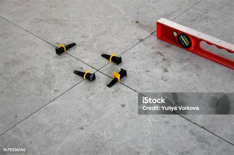 Bubble Level Lying On The Concrete Floor Tiling Leveling System Stock