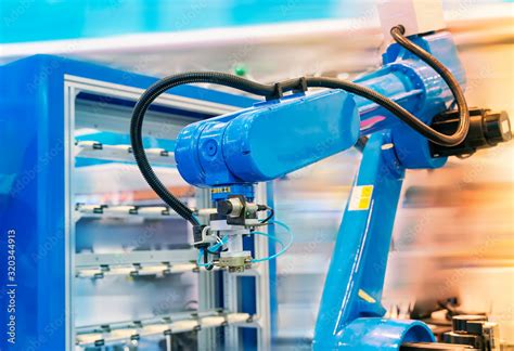 Automation System Control Application On Automate Robot Arm In Smart Manufacturing Background