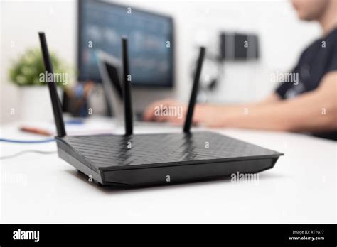 Modern Dual Band Wireless Router Man Working In The Background Fast And Wireless Internet