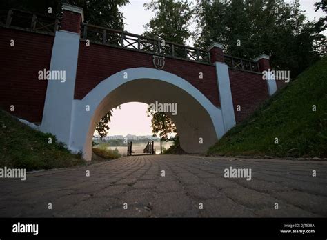 Pedestrian Bridge With An Arch In The City Park The Camera Installed At Ground Level Stock