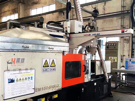 The Companys Injection Molding Machines Three Axis Servo Robotic Arm