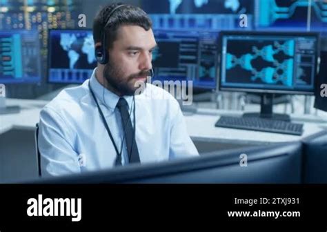 In The System Monitoring Room Dispatcher Wearing Headset Observers Proper Functioning Of The