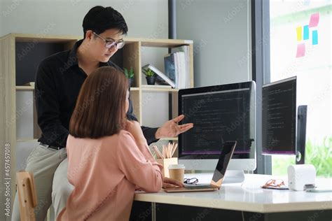 Side View Of Female Programmer Working With Computer At Modern Office