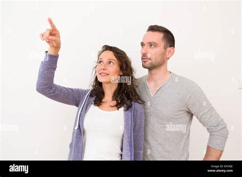 Couple Using Imaginary Touchscreen Interface Stock Photo Alamy