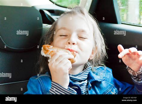 Eating Cute Girl With Blond Wet Hair Sitting Inside Car Stock Photo Alamy