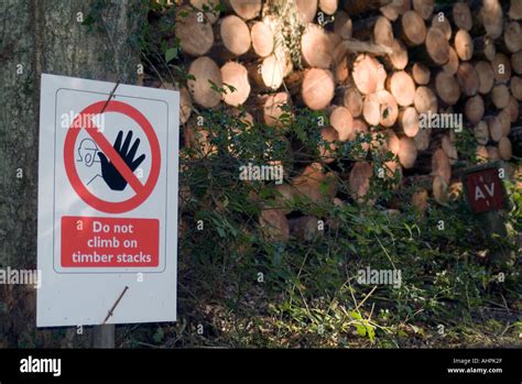 Sign In Woods Warning About The Danger Of Climbing On A Wood Stack Stock Photo Alamy