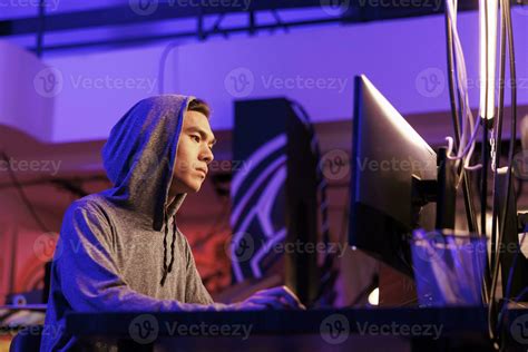 Asian Hacker Breaking Law While Doing Data Mining Using Malicious Software Young Man In Hood