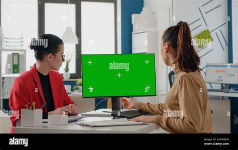 People Doing Teamwork With Green Screen On Monitor Women Coworkers