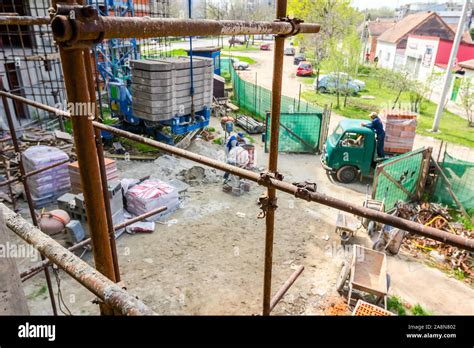 Rusty Scaffold Is Placed Against Edifice Building Under Construction Building Site In