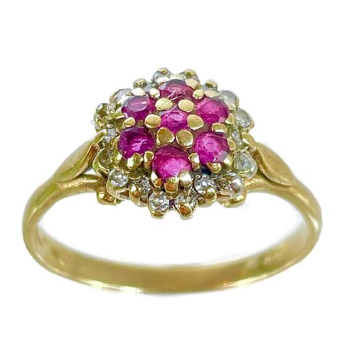 Lot 372 A 9ct Diamond And Ruby Cluster Ring