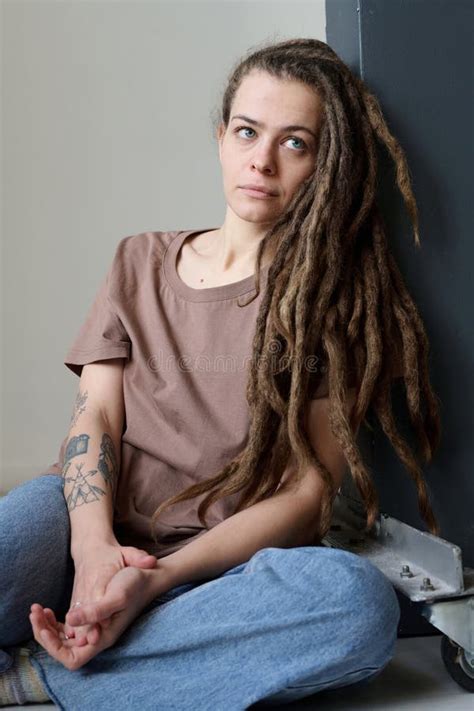 Vertical Portrait Of Young Caucasian Woman With Long Dreadlocks Stock