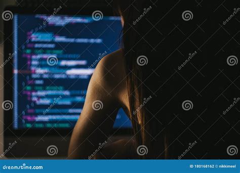The Programmer Writes The Program Code At Night In A Dark Room Hands On Laptop Keyboard And