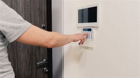 Man Enters The Password Code To Enter The Room Security System