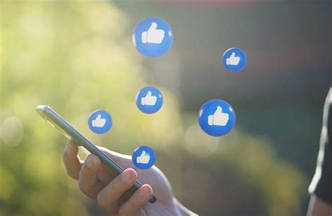 Premium Photo Man Hand Using Smartphone With Like Icon Notification Flying