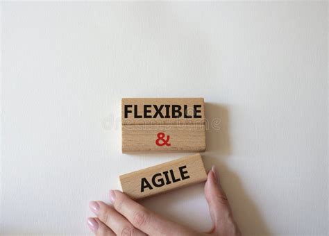 Flexible And Agile Symbol Concept Word Flexible And Agile On Wooden Blocks Beautiful White