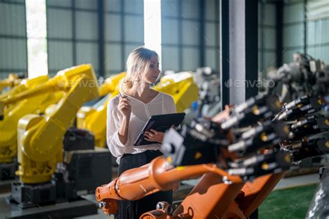 Engineer Inspecting Automatic Ai Robot Arms And Machines In Factoryengineer Inspecting