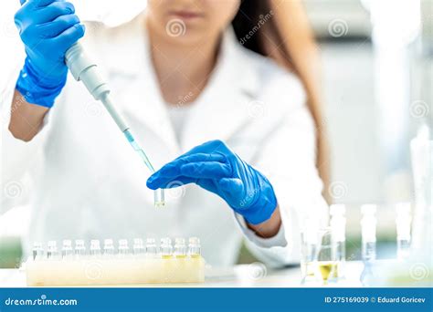 Conducting Chemical Research In A Research Laboratory Pipetting The