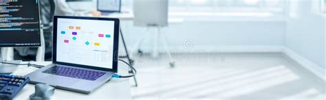 Software Developer Reviews Ux Ui Design Diagrams While Coding At A