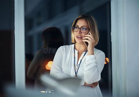 Dont Wait Up Honey Im Working Late A Businesswoman Talking On A Mobile Phone During A Late