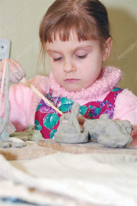 Girl Modeling Of Clay Stock Photo By Cherry Merry 1240449
