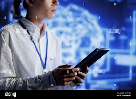 admin using tablet in server farm to maintenance artificial