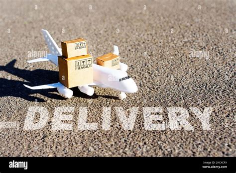 Tiny Shipping Boxes Placed On A Toy Aircraft Parked On The Runway