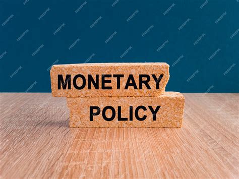 Premium Photo Concept Words Monetary Policy On Brick Blocks Ideas For Increase Or Decrease
