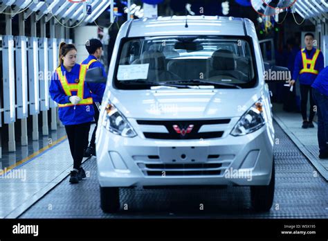 File Chinese Workers Assemble Wuling Motors On The Assembly Line At