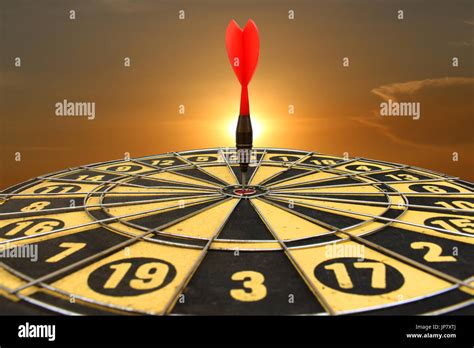 Red Dart Arrow Hitting In The Target Center Of Dartboard Stock Photo Alamy