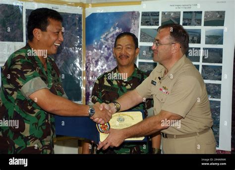 Us Navy Commodore Right Presents A Certificate Of Appreciation To