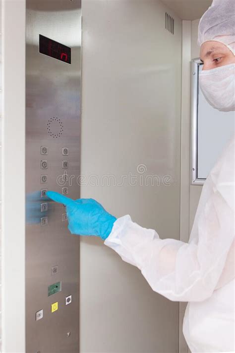 A Man In A Protective Suit Gloves And Face Mask Stock Photo Image Of Isolated Infection